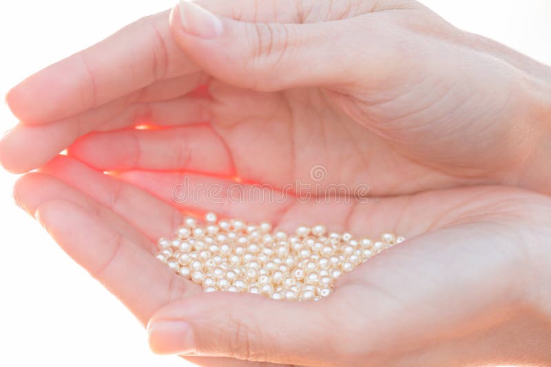Hands holding white pearl stock image. Image of hand - 49271275