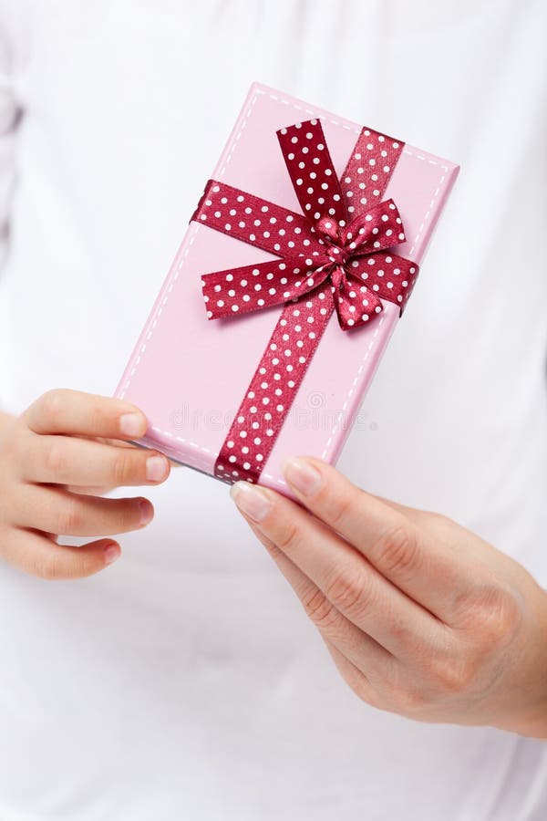 The Joy Of Giving - Small Gift Box In Woman And Child Hands Stock Image ...