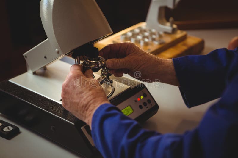 Hands of Horologist Repairing a Watch Stock Photo - Image of metallic ...