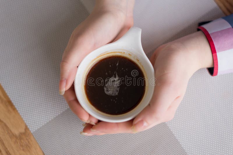 Hands Hugging a Cup of Coffee on the Table Stock Image - Image of close ...