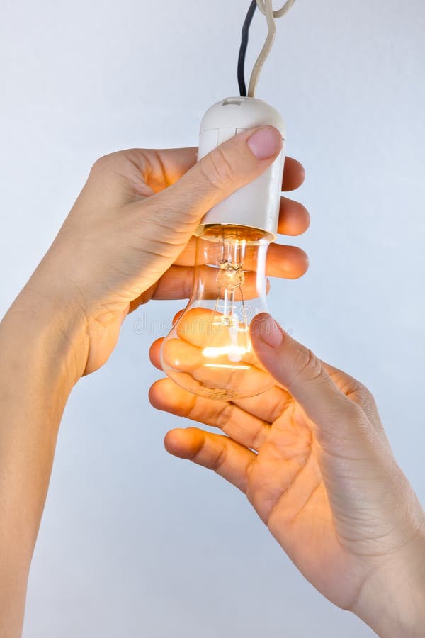 Hands with Incandescent Light Bulb Stock Photo - Image of people ...
