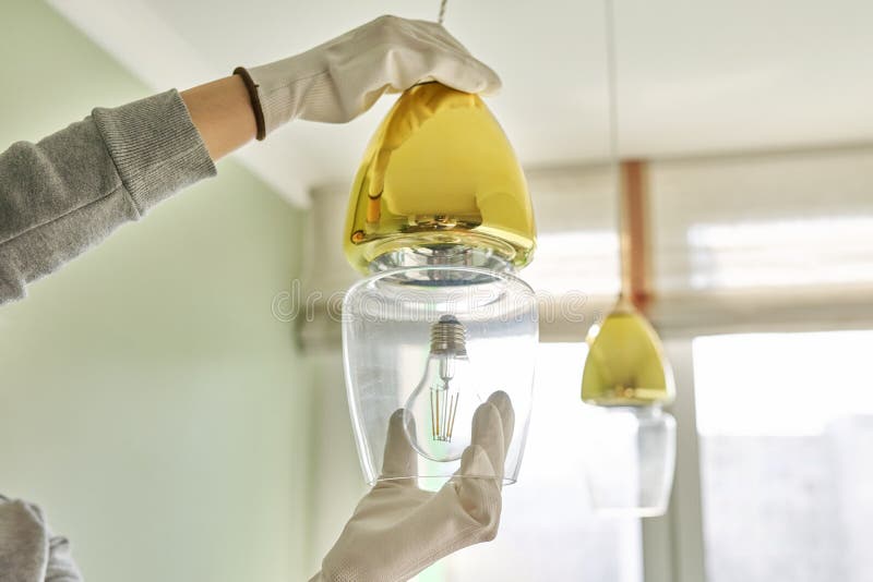 Hands Installing LED Bulb in Lamp, Chandelier Stock Photo - Image of ...