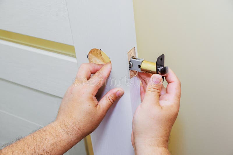 Door Lock Installation Process with Hands Fixing a Lock Cylinder at ...