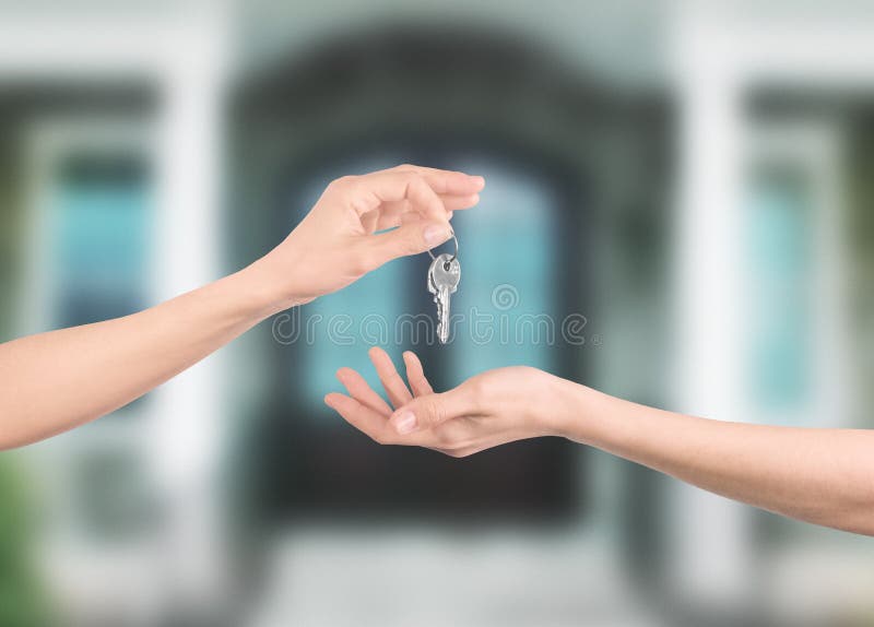 Hands with Keys with House on Background Stock Photo - Image of give ...