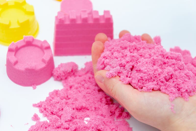 Hands of a Kid Playing with Pink Magic Sand Stock Image - Image of ...
