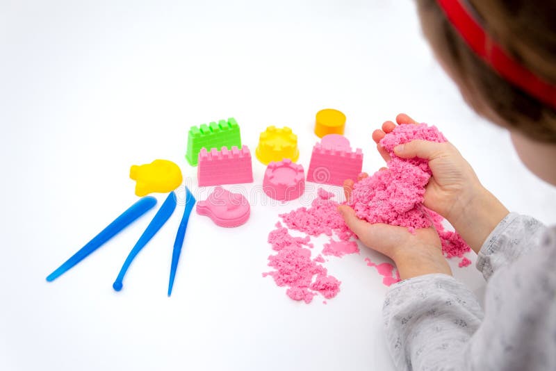 Hands of a Kid Playing with Pink Magic Sand Stock Photo - Image of game ...