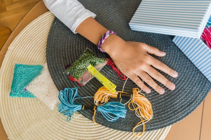 Hands of a Kid with Threads Bracelets and Materials Stock Image - Image ...