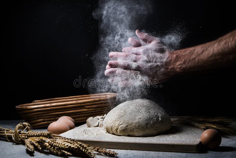 Hands Kneading Bread Dough Against a Black Background. a Composition ...