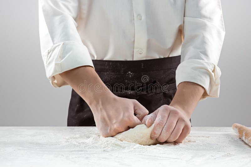 Hands kneading a dough stock image. Image of mixing, cook - 83875717
