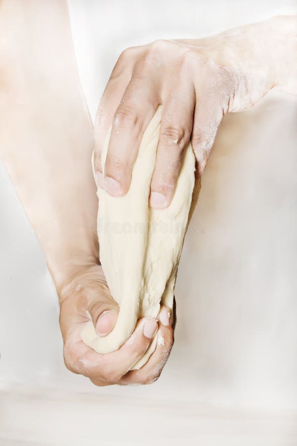 Hands kneading a dough stock photo. Image of mashing - 79754002