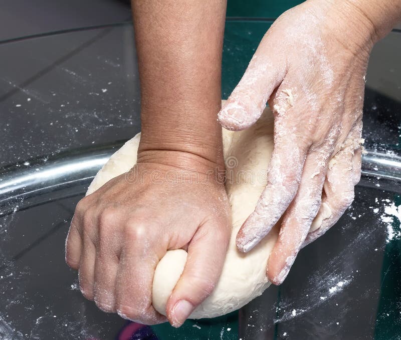 Hands kneading a dough stock photo. Image of ingredient - 46924386