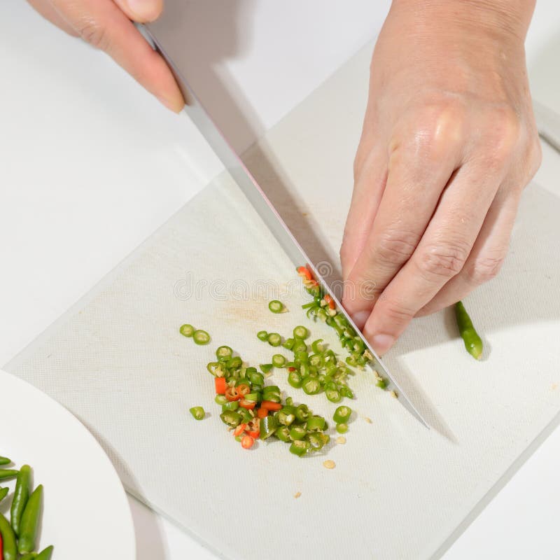 Hands and Knife for Slice Pepper on Plastic Plate Block Stock Photo ...