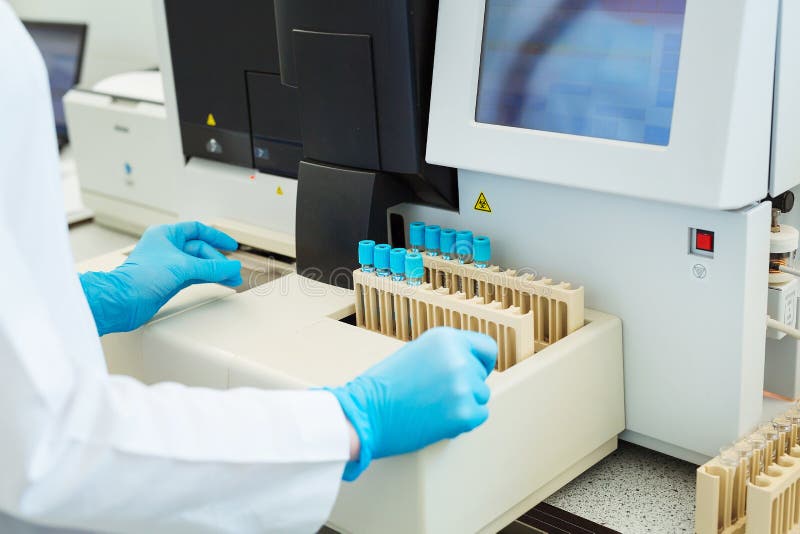 Hands of Laboratory Assistant Loading Sample Tubes for Coagulation Test ...