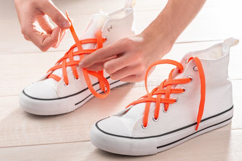 Hands Lacing Up White Sneakers Stock Photo - Image of shoelace, rubber ...