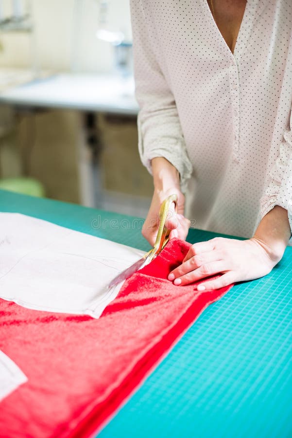 Hands of Lady Tailor Working in Her Studio, Tools and Fabric Samples on ...