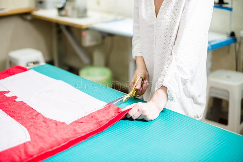 Hands of Lady Tailor Working in Her Studio, Tools and Fabric Samples on ...