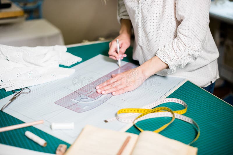 Hands of Lady Tailor Working in Her Studio, Tools and Fabric Samples on ...