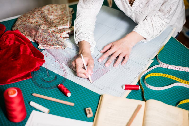 Hands of Lady Tailor Working in Her Studio, Tools and Fabric Samples on ...