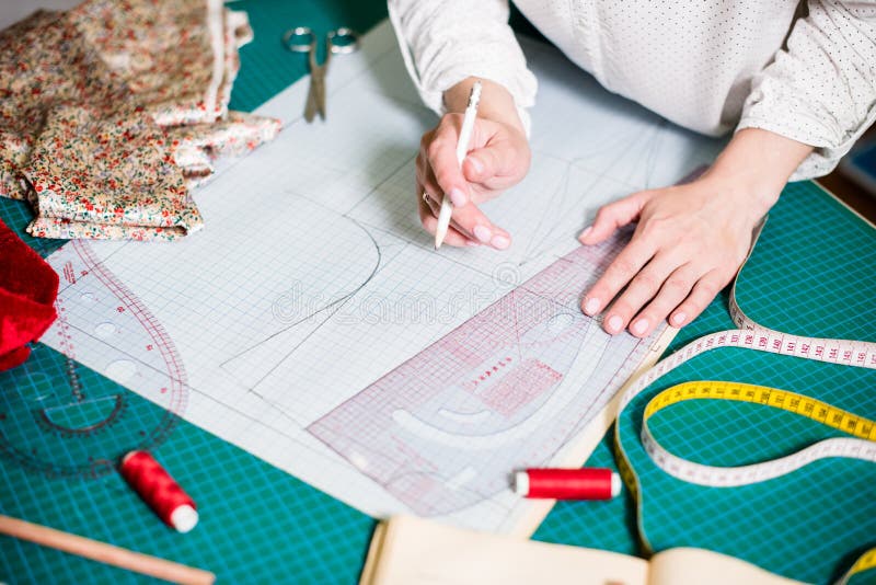 Hands of Lady Tailor Working in Her Studio, Tools and Fabric Samples on ...
