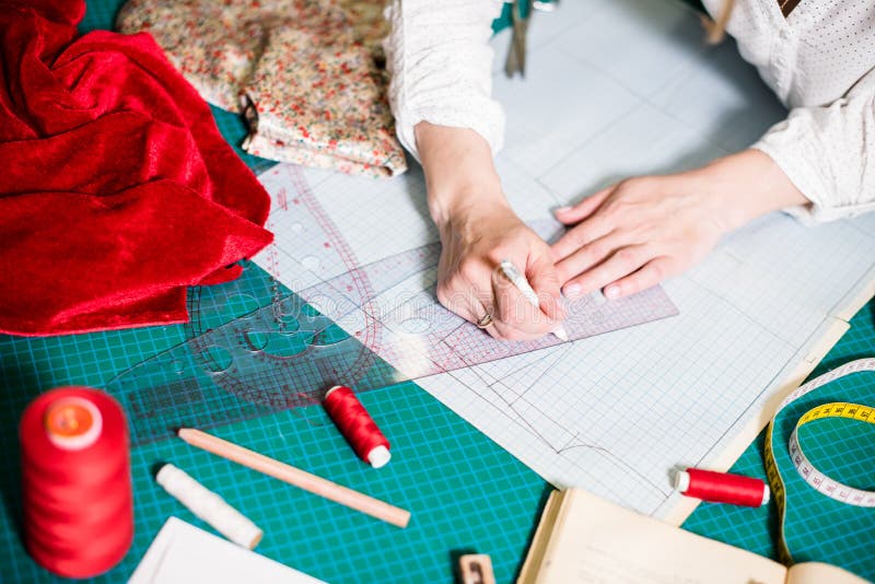 Hands of Lady Tailor Working in Her Studio, Tools and Fabric Samples on ...