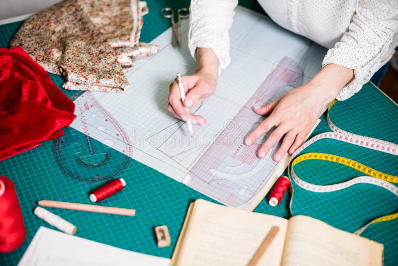 Hands of Lady Tailor Working in Her Studio, Tools and Fabric Samples on ...