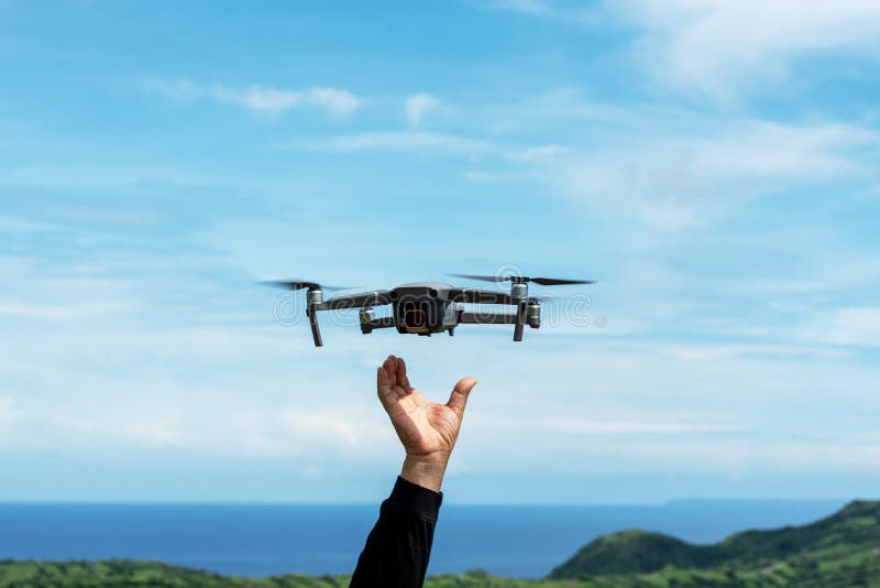 Hands launching a drone stock image. Image of drone - 154050171