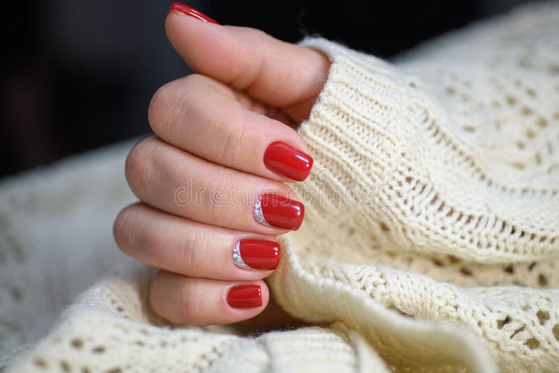 Hands with Long Artificial Manicured Nails Colored with Red Nail Polish ...