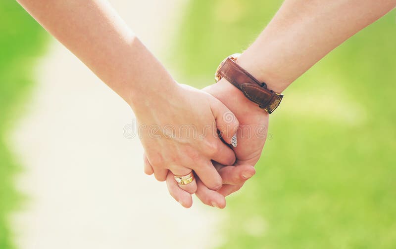 Hands of lovers on grass stock image. Image of romantic - 14479671