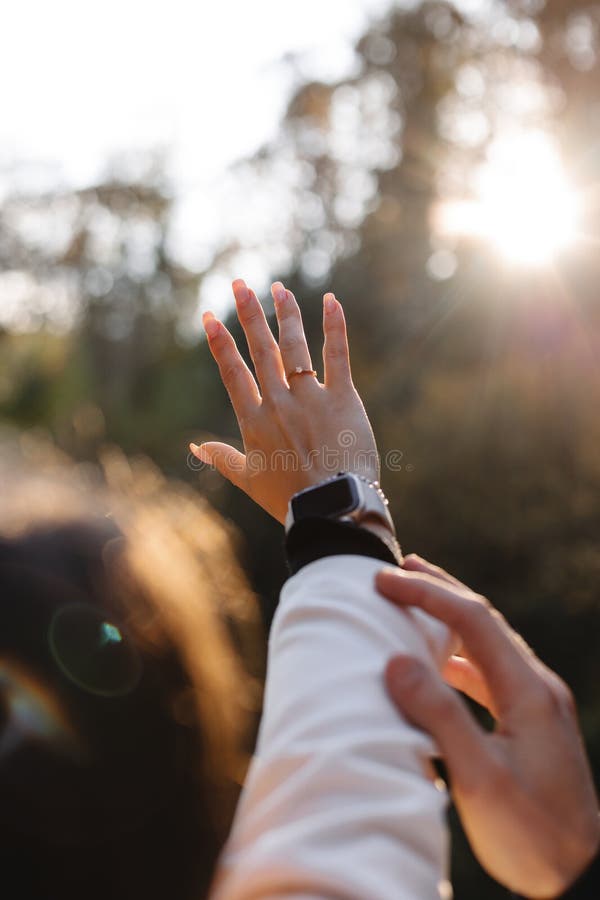 The Hands of the Lovers Show the Wedding Ring in the Sunlight Stock ...