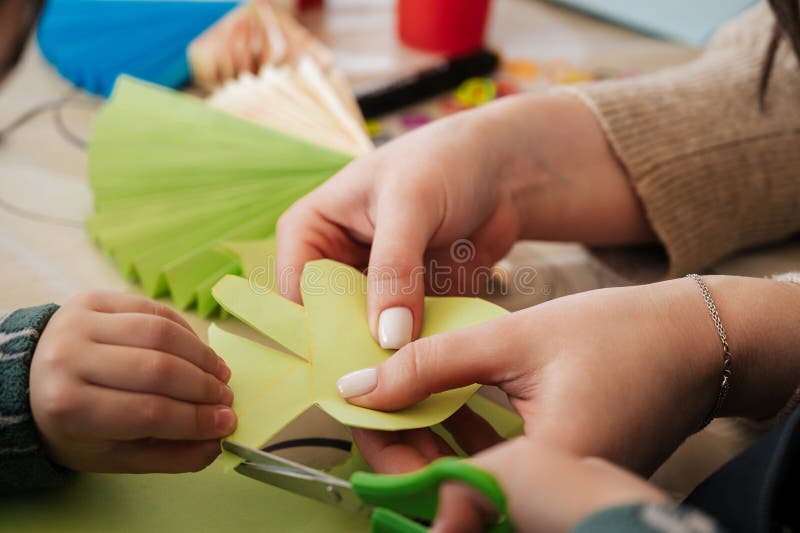 Hands Make Crafts from Colored Paper at Table Stock Photo - Image of ...