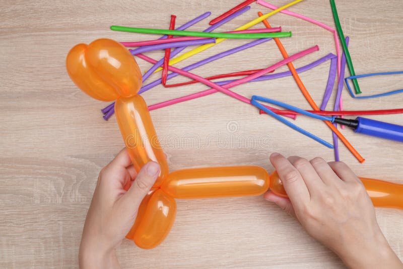 Hands Making an Animal from a Balloon Stock Photo - Image of inflatable ...