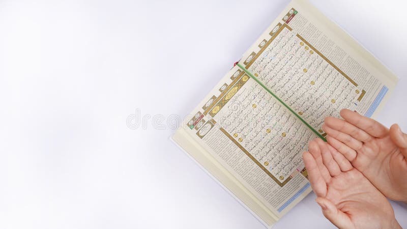 Hands Making Dua in Front of an Open Holy Quran Stock Photo - Image of ...