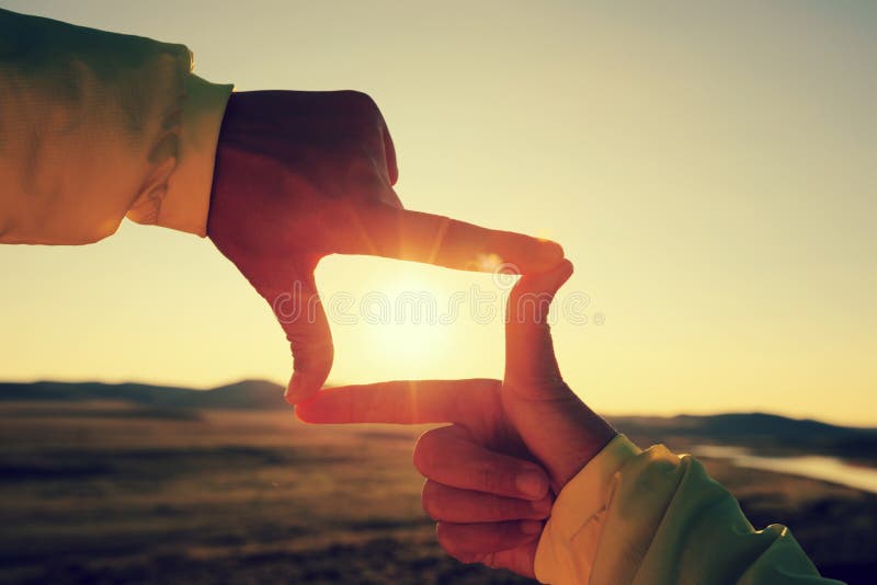 Hands Making a Frame Sign Over Sunset Sky Stock Photo - Image of golden ...