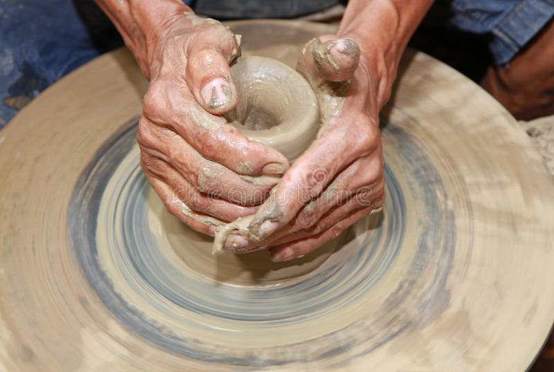 Close-up of Hands Making Pottery from Clay on a Wheel. Stock Photo ...