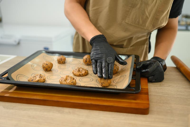 Hands of Male Baker Arranging Cookie Dough on a Baking Tray Stock Image ...