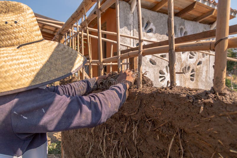 Hands a Man Building a Wall with Reed and Mud Stock Photo - Image of ...