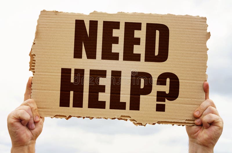 In the Hands of a Man is a Cardboard Sign with the Inscription - NEED ...