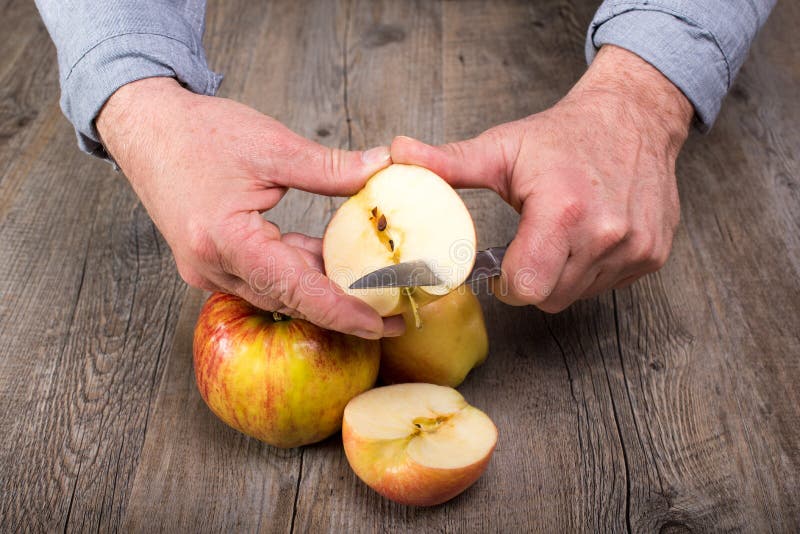 Hands of a Man Cutting an Apple Stock Image - Image of caucasian, peel ...