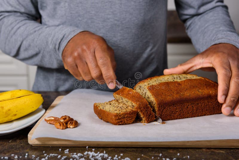 Hands of a Man Cutting Banana Bread Stock Image - Image of grain ...