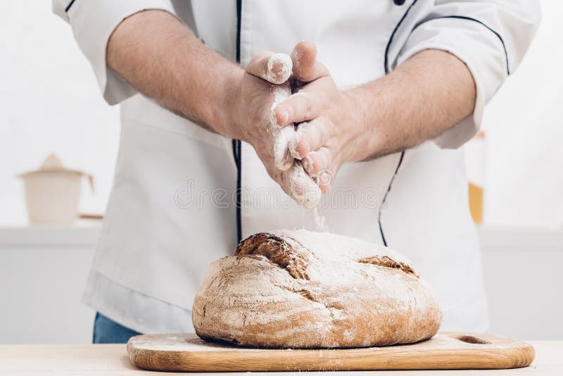 Hands of Man and Fresh Baked Bread on Wooden Table. Soft Light Stock ...