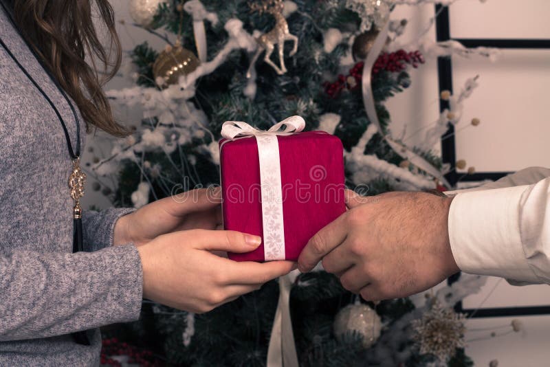 Hands of Man Giving a Christmas Gift Stock Photo - Image of lights ...
