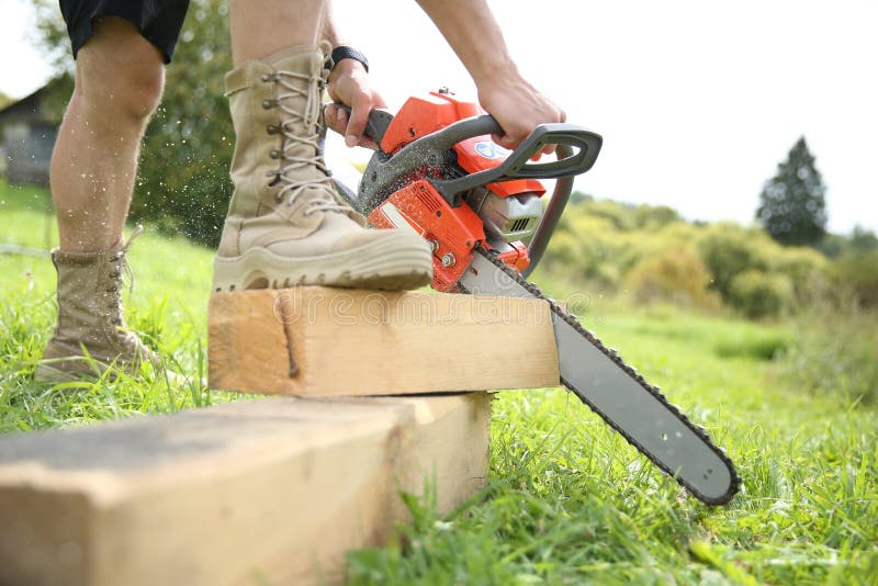 Hands of a Man Holding a Chainsaw. Stock Image - Image of blade, petrol ...