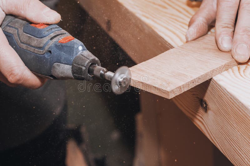 Hands of a Man Holding Dremel Tool with an Installed Small Cir Stock ...