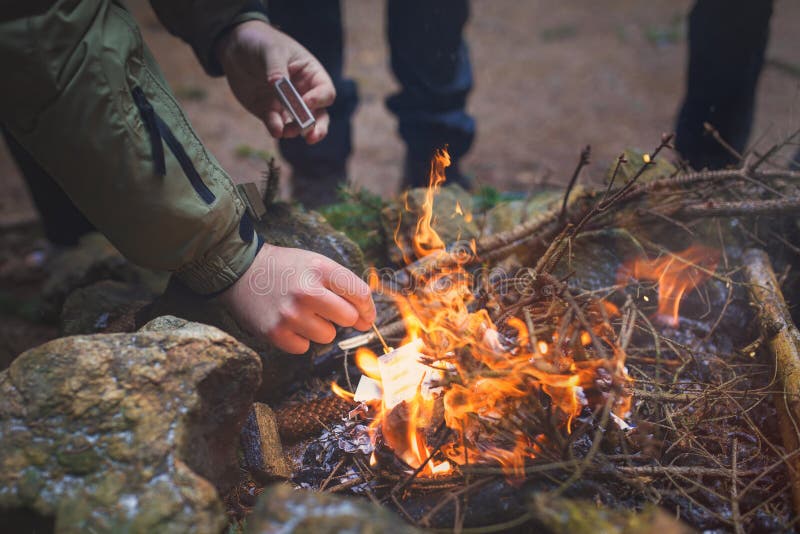 Hands of a Man Lighting a Fire in a Forest Fireplace in Cold Winter ...