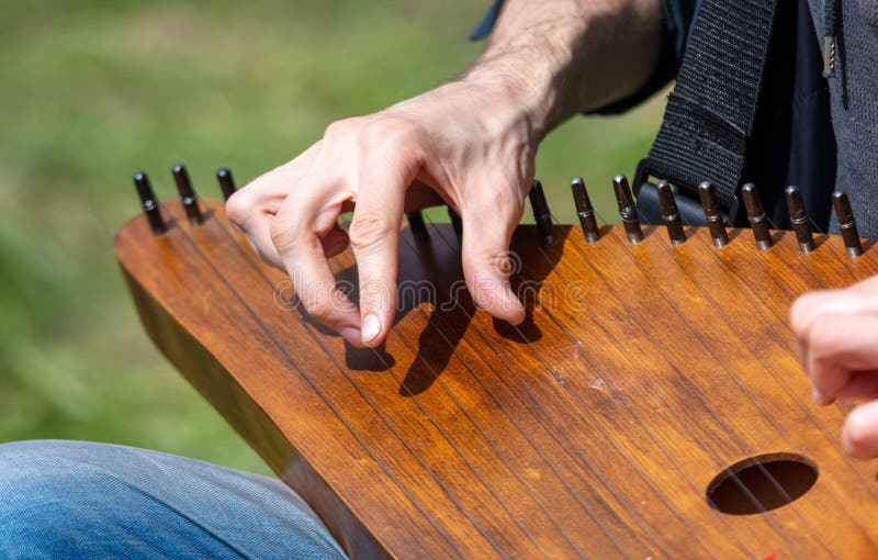 The Hands of a Man Playing the Harp on the Strings Stock Image - Image ...