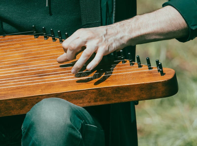 The Hands of a Man Playing the Harp on the Strings Stock Photo - Image ...