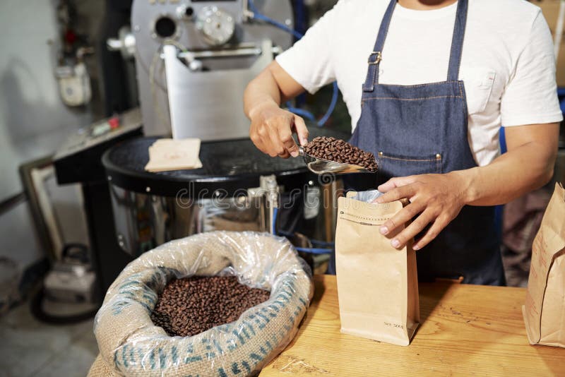 Man packing coffee stock image. Image of closeup, coffee - 175140967