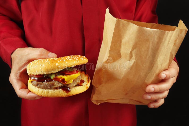 Young Cut Boy Take Out Something From A Paper Package On White ...