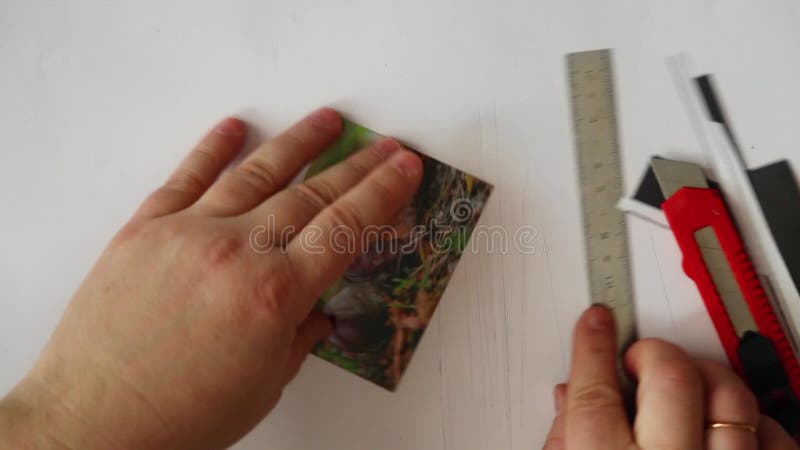 The Hands of a Man with a Stationery Knife and a Ruler are Cut Off ...