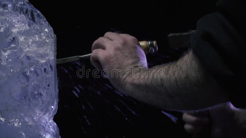 Close Up of a Man Breaking Off Ice with a Chisel and Hammer, Ice ...